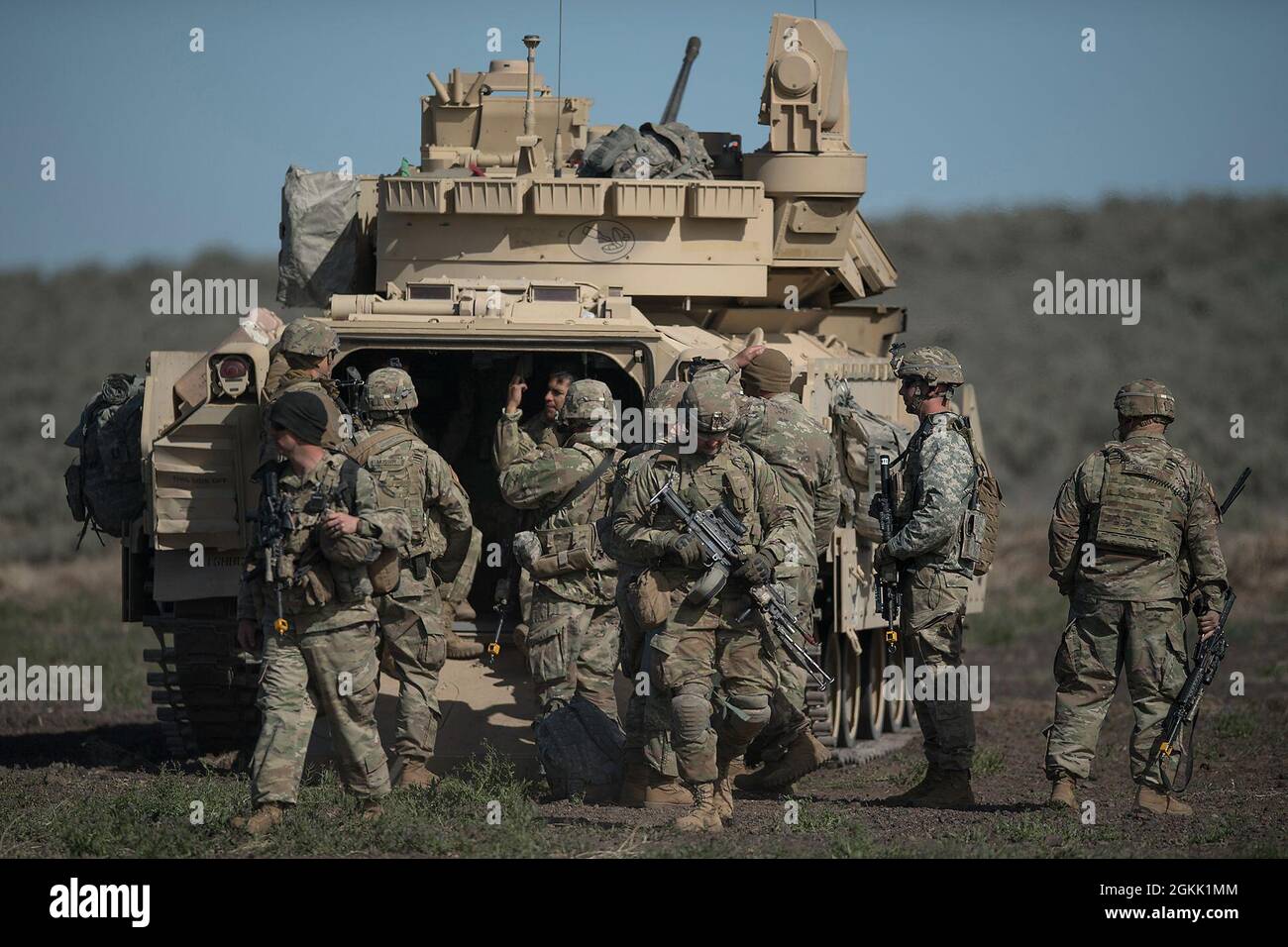 Soldiers from Charlie Company gather together to prepare for the day’s ...