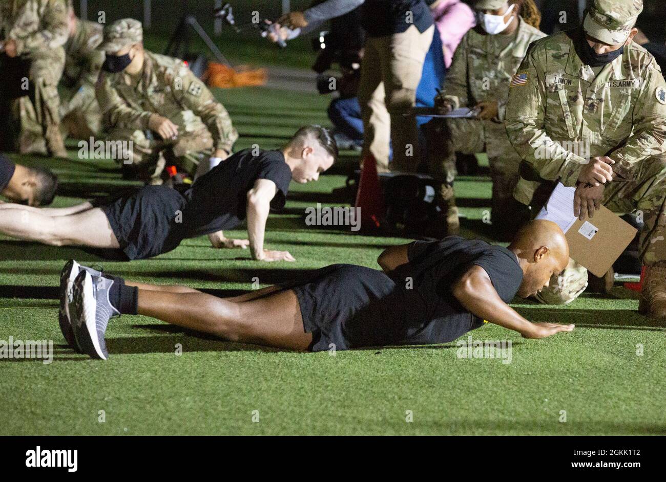 U.S. Army Staff Sgt. Corey Walton executes hand release push-ups with ...