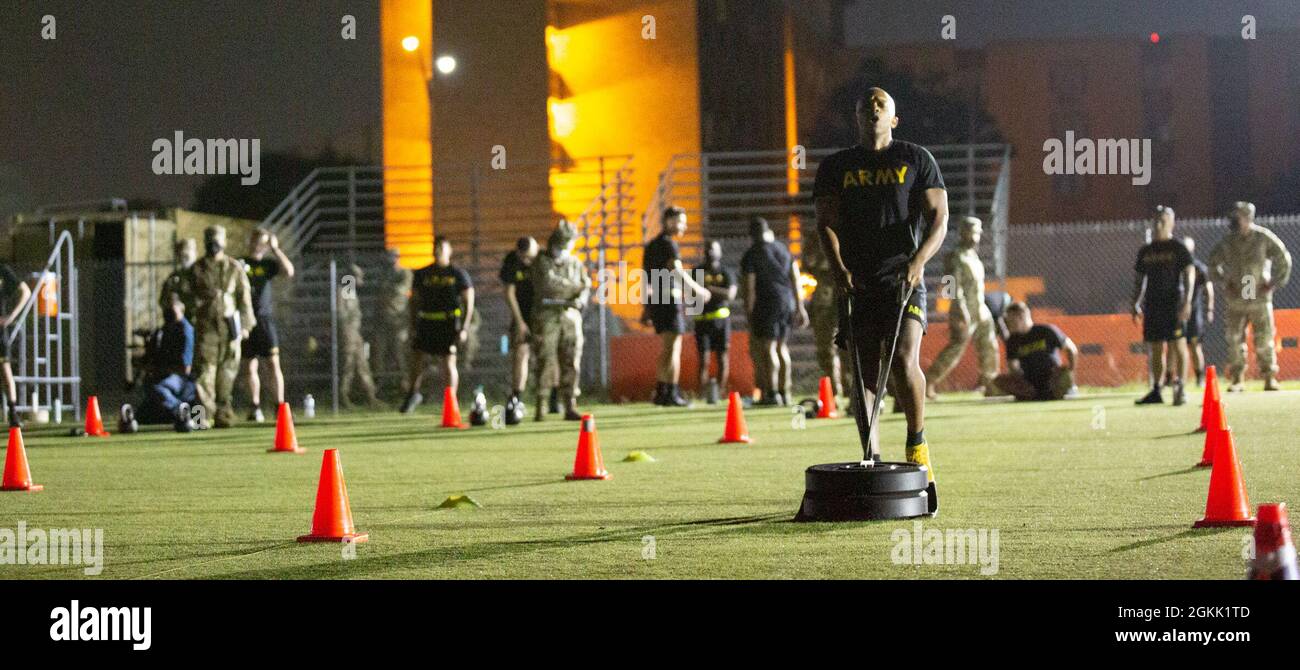 U.S. Army Staff Sgt. Corey Walton completes the sprint drag carry event ...