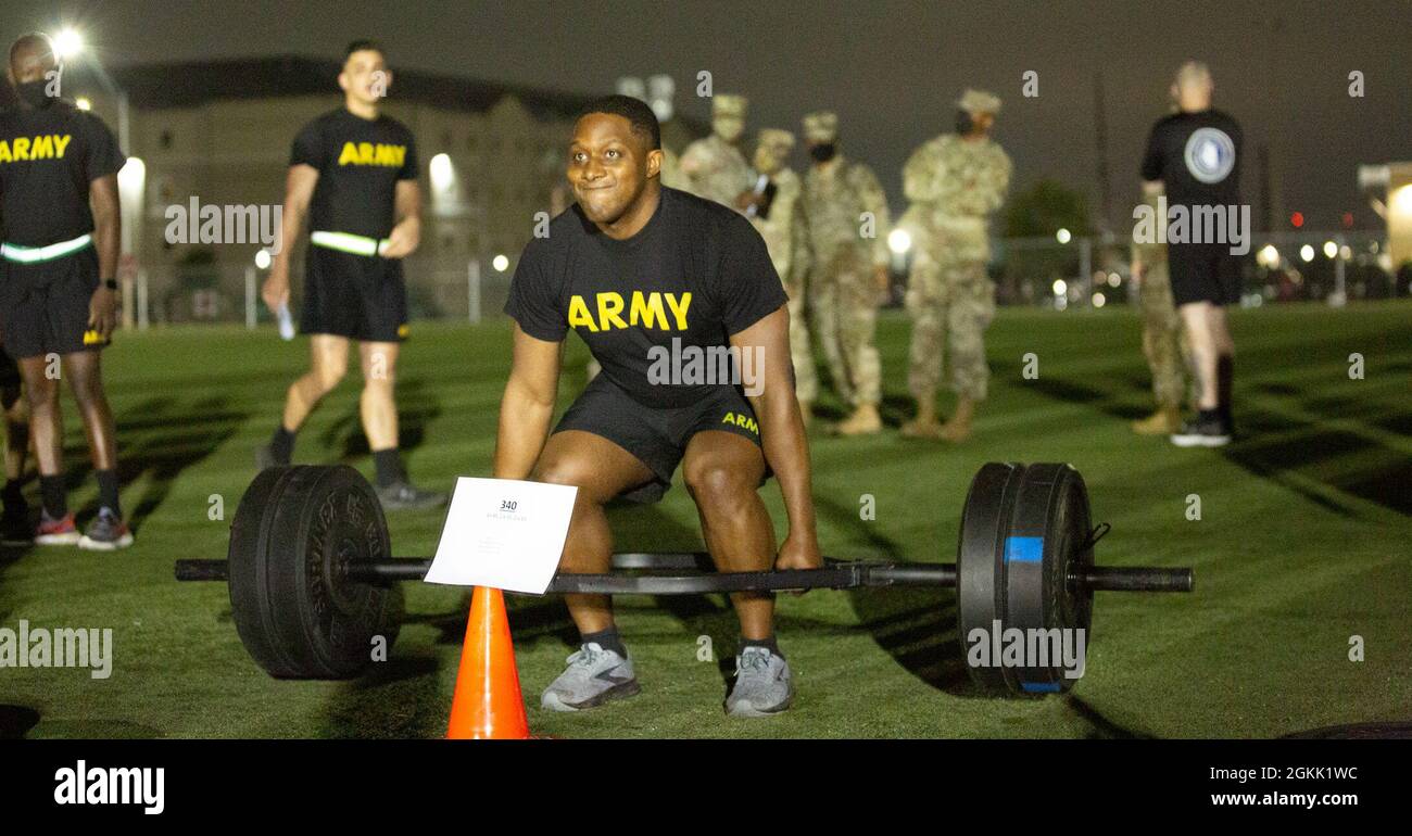 A U.S. Army Soldier warms up to prepare to execute the max three ...