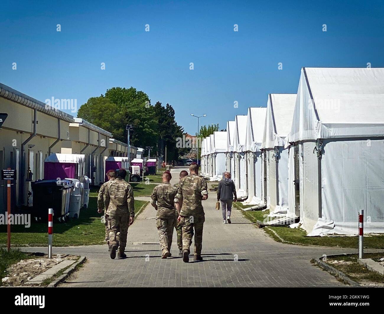 Soldiers deployed to Mihail Kogălniceanu Air Base, Romania, walk ...