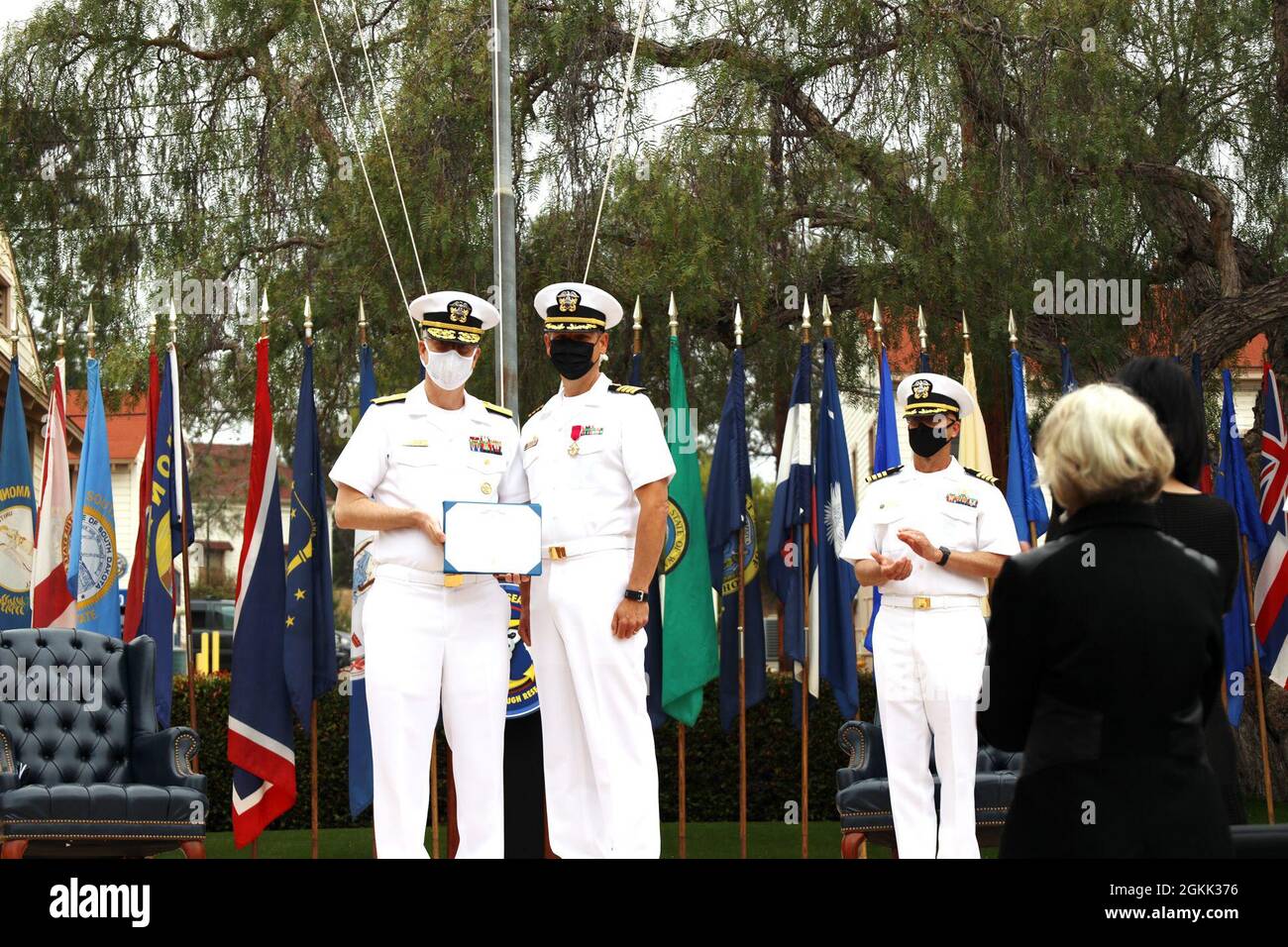 Naval Medical Forces Pacific Commander Rear Adm. Tim Weber presents an ...