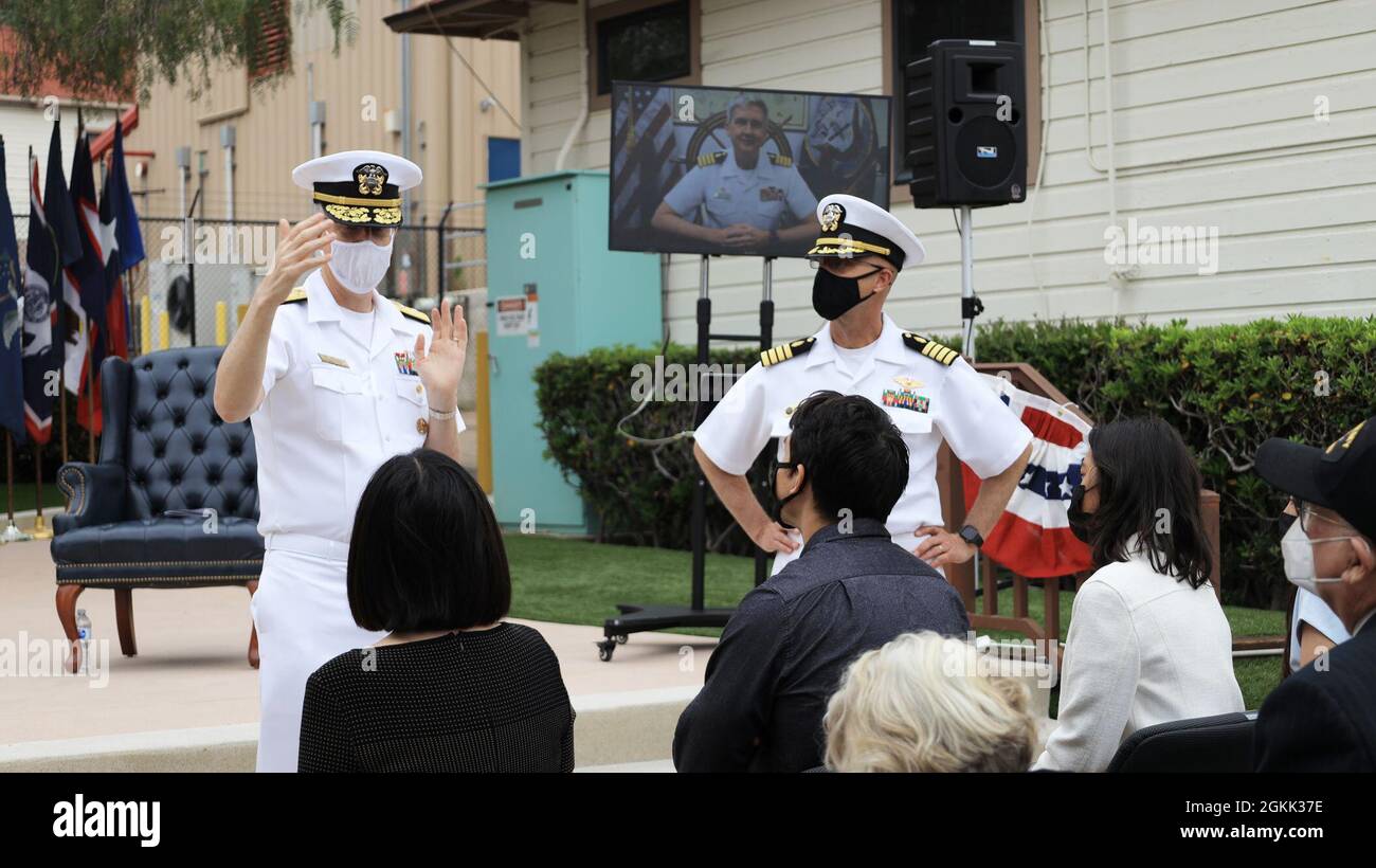 Naval Medical Forces Pacific Commander Rear Adm. Tim Weber talks with ...