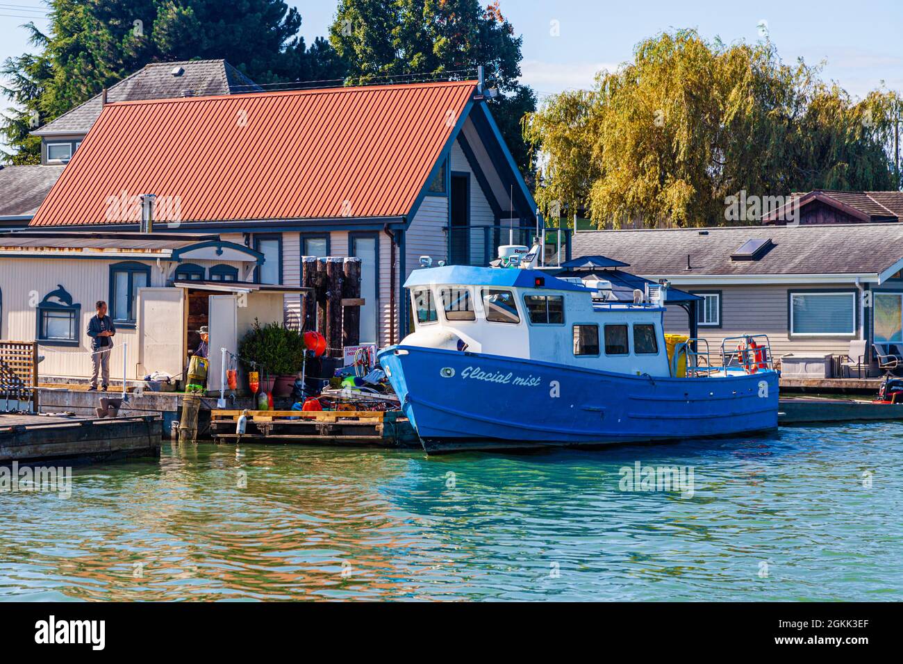 Floating homes along a channel of the Fraser River delta near Ladner ...