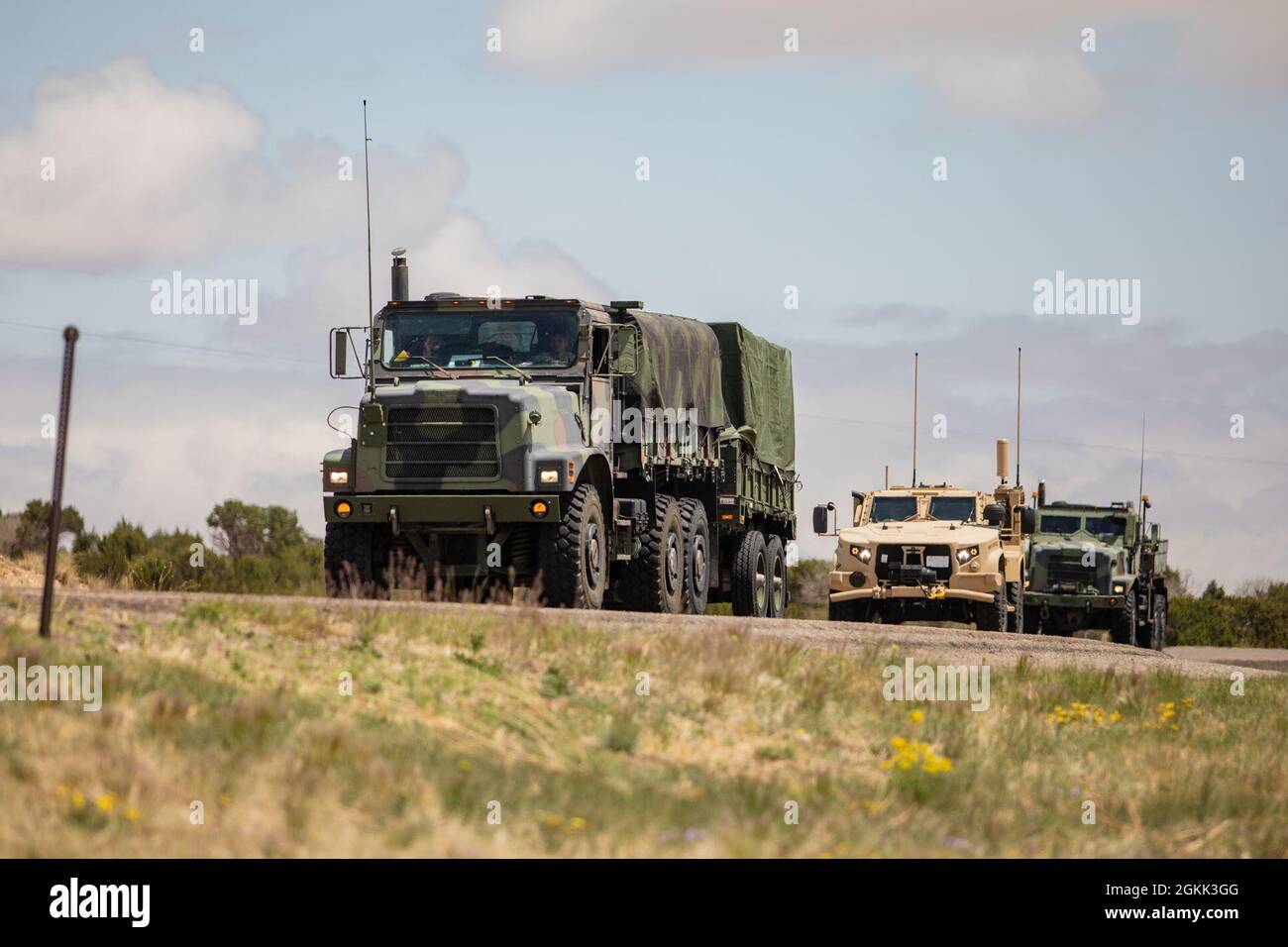 U.S. Marines drive tactical vehicles onto the highway near Albuquerque ...