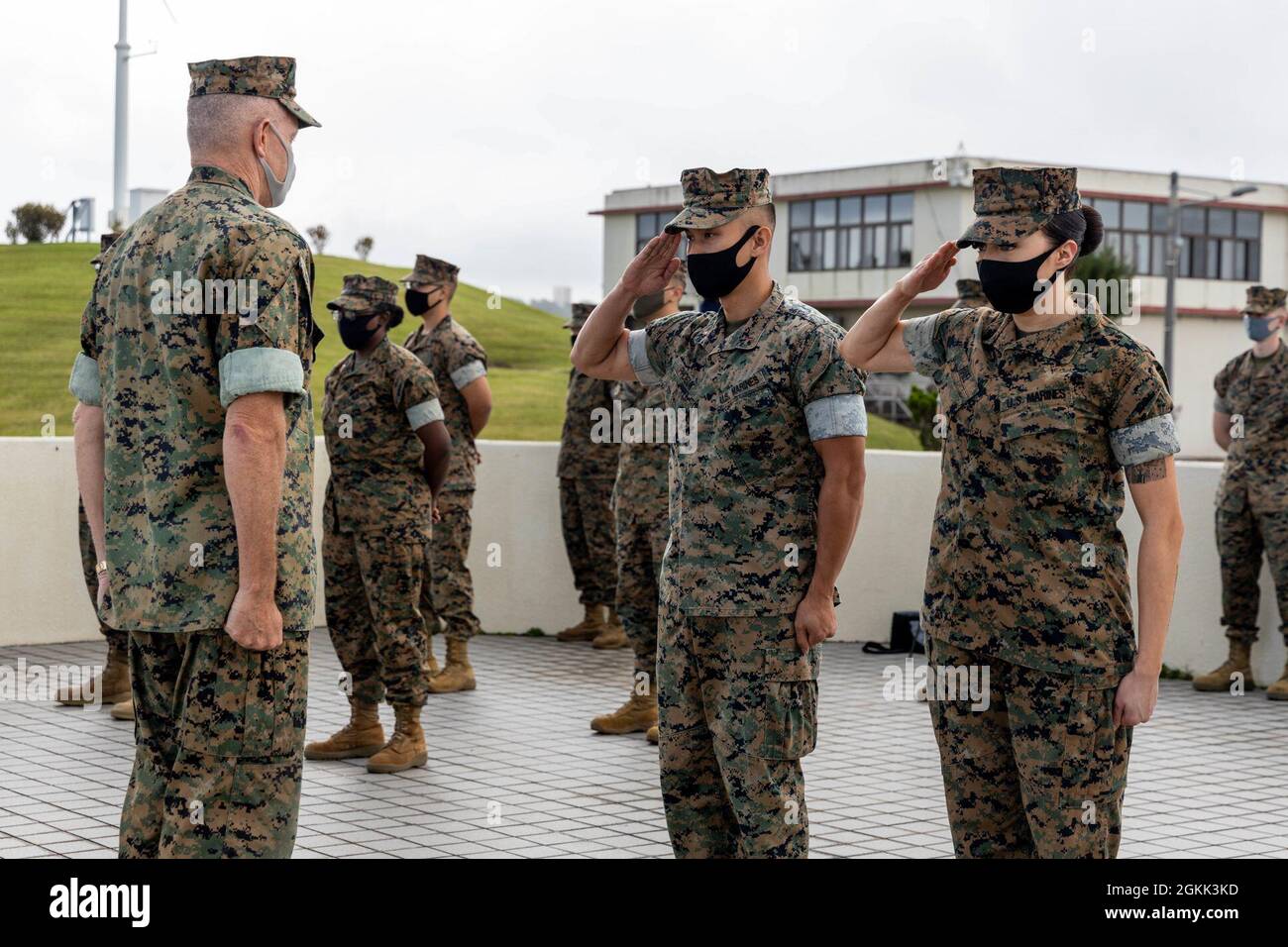 U.S. Marine Corps Chief Warrant Officer 3 Sambo Phoeuk, middle, the ...