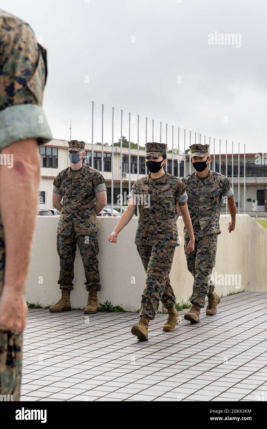 U.S. Marine Corps Cpl. Rachel Rael, center, an administrative ...