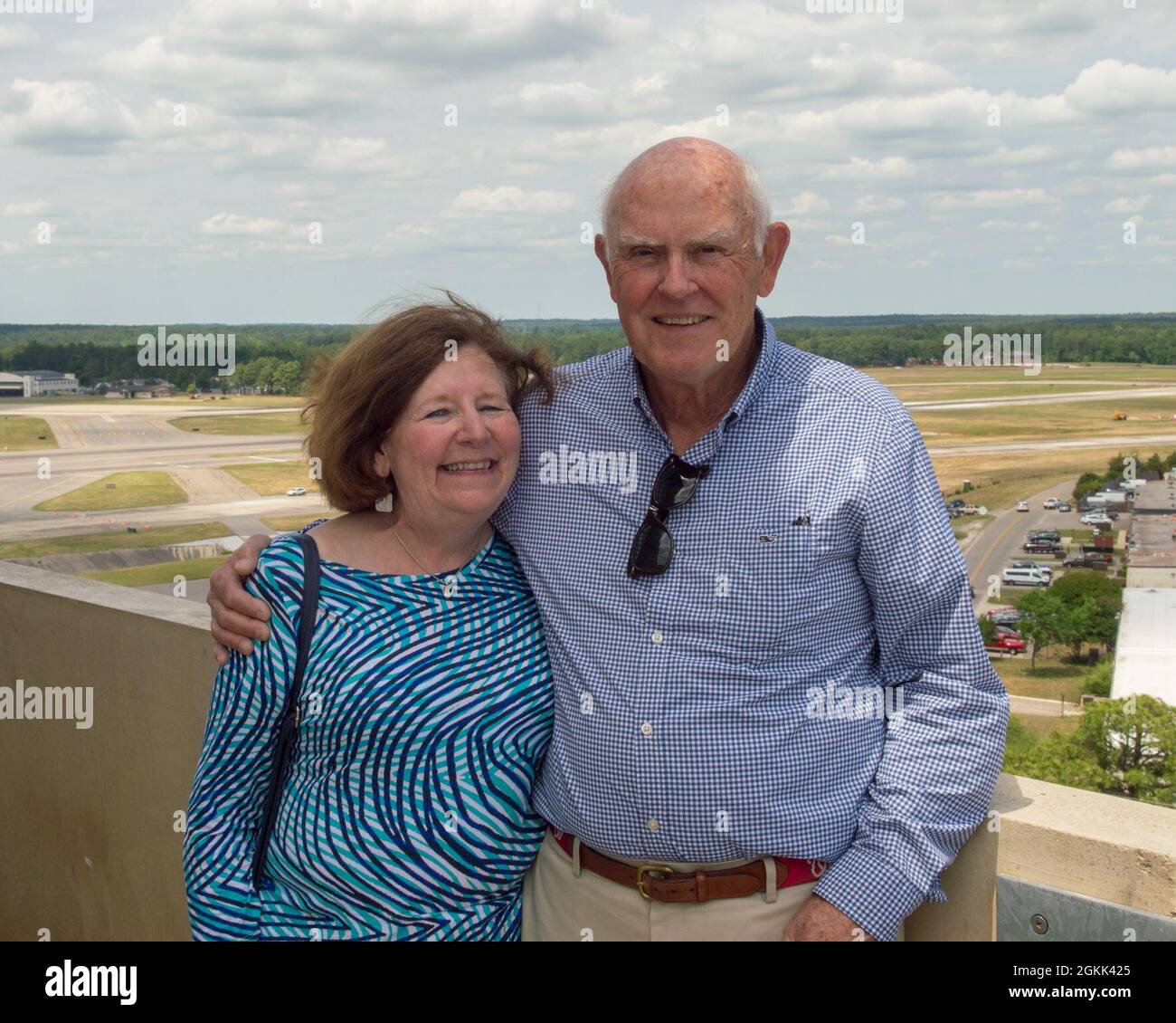 Mr. Jim Wilging, joined by his wife Rita McLaughlin, pose for a photo ...