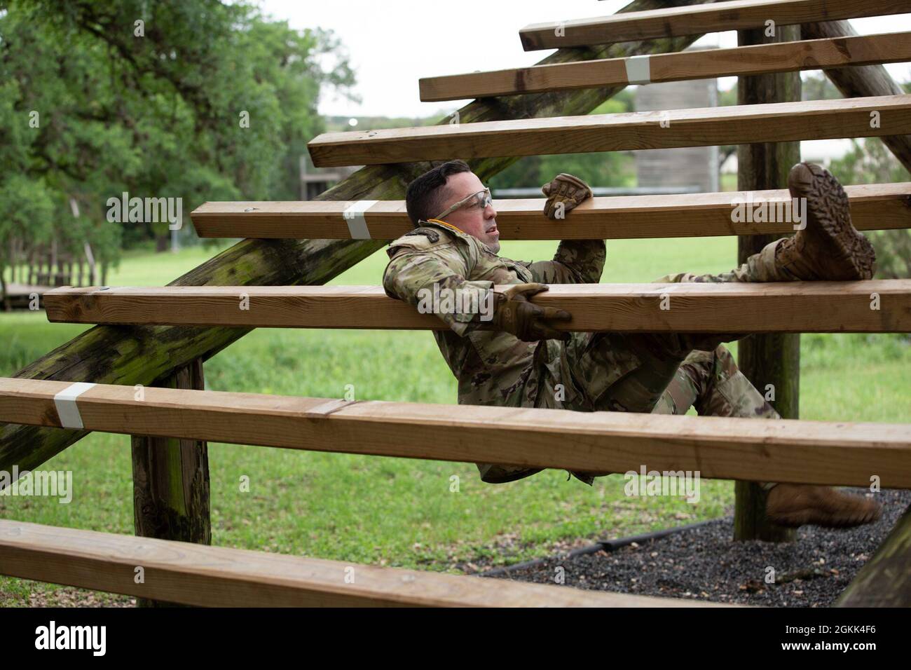 U.S. Army Sgt. 1st Class Dylan Browning weaves through the over under ...