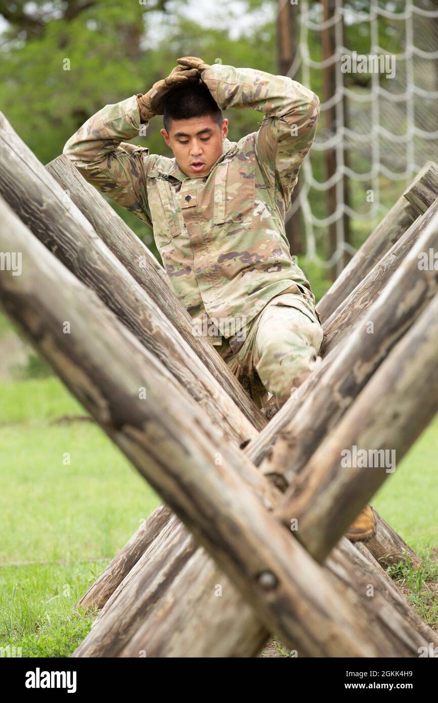 U.S. Army Spc. Jason Mark Yadoa steps through the cross beams while ...