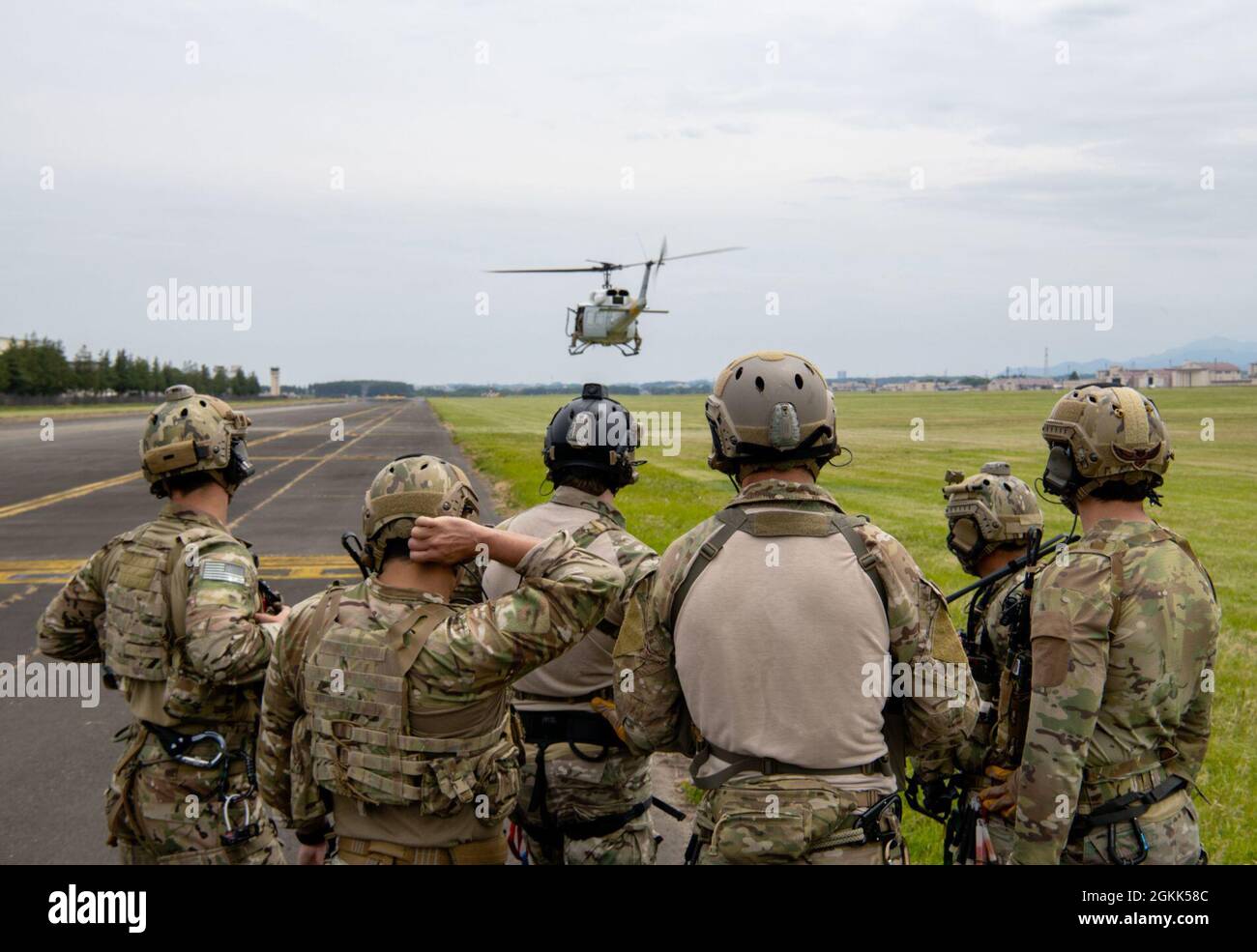 Airmen from the 320th Special Tactics Squadron watch as a UH-1N ...