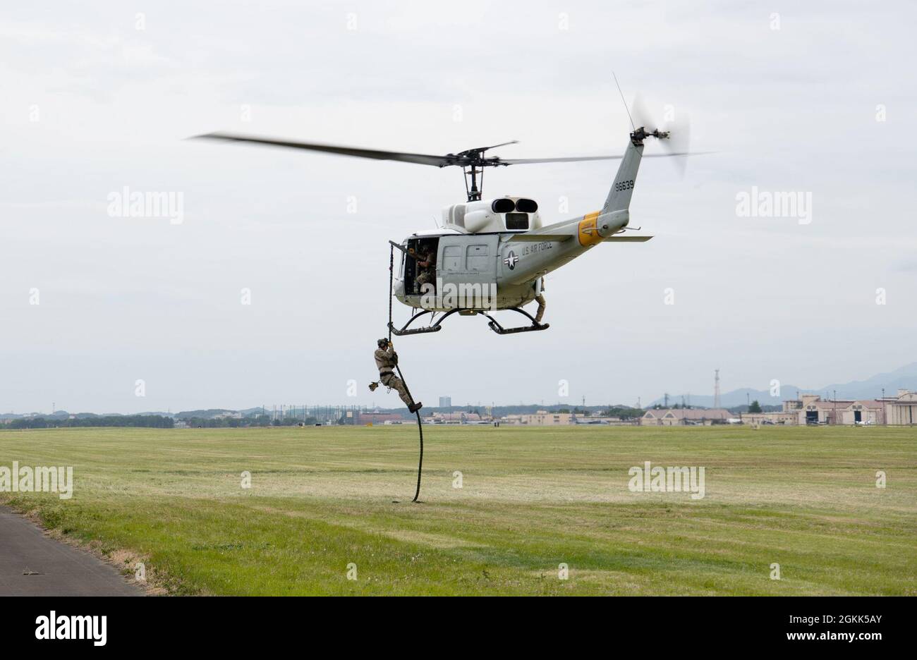 A 320th Special Tactics Squadron Airman fast ropes from a UH-1N ...
