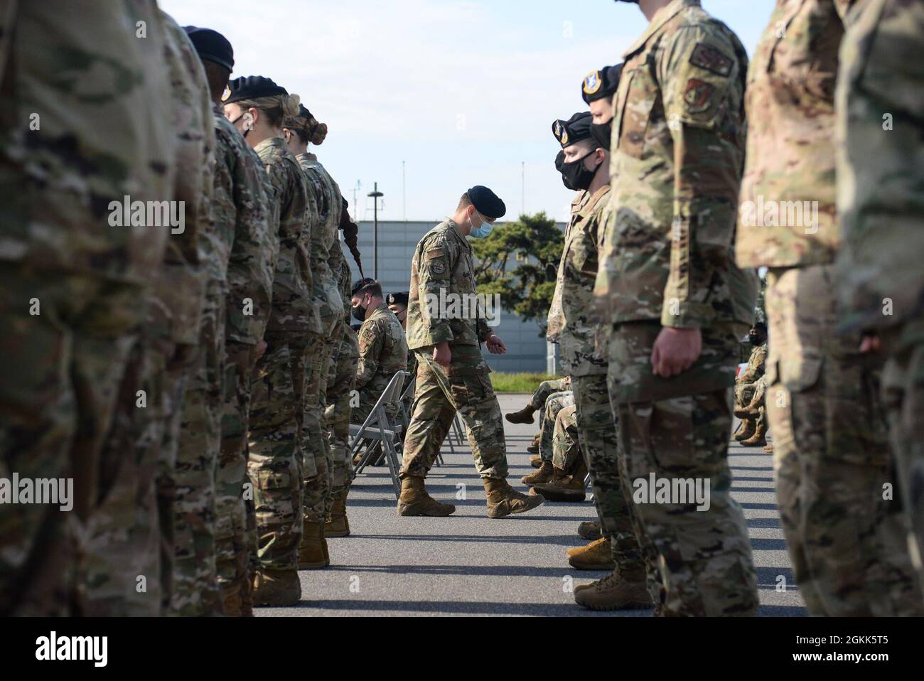 An 8th Security Forces Squadron defender walks past a formation during ...