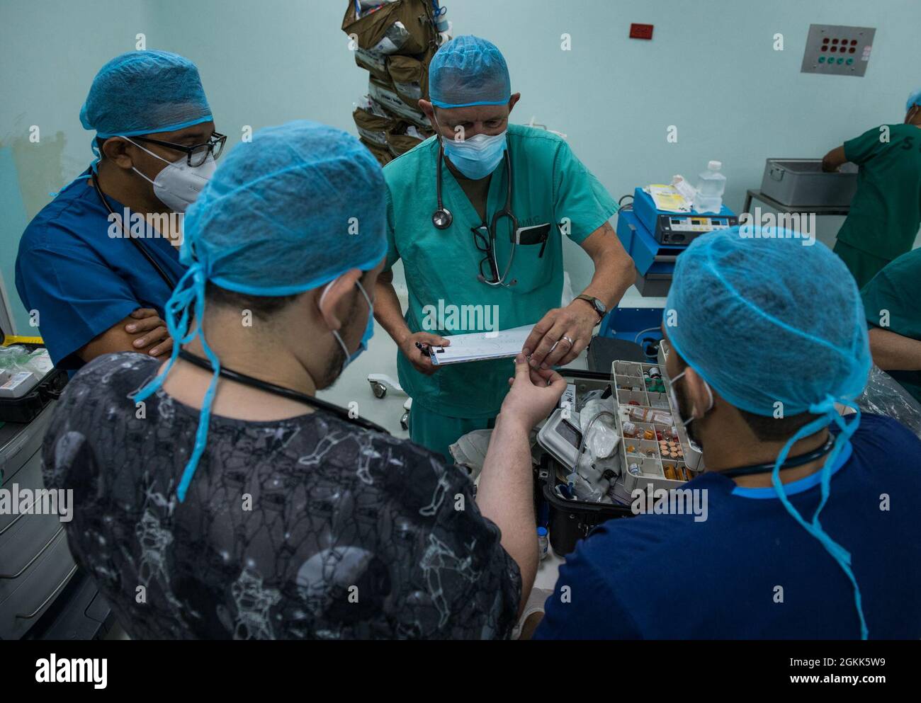 U.S. Army Col. William Kogl, center, a nurse anesthetist with the ...