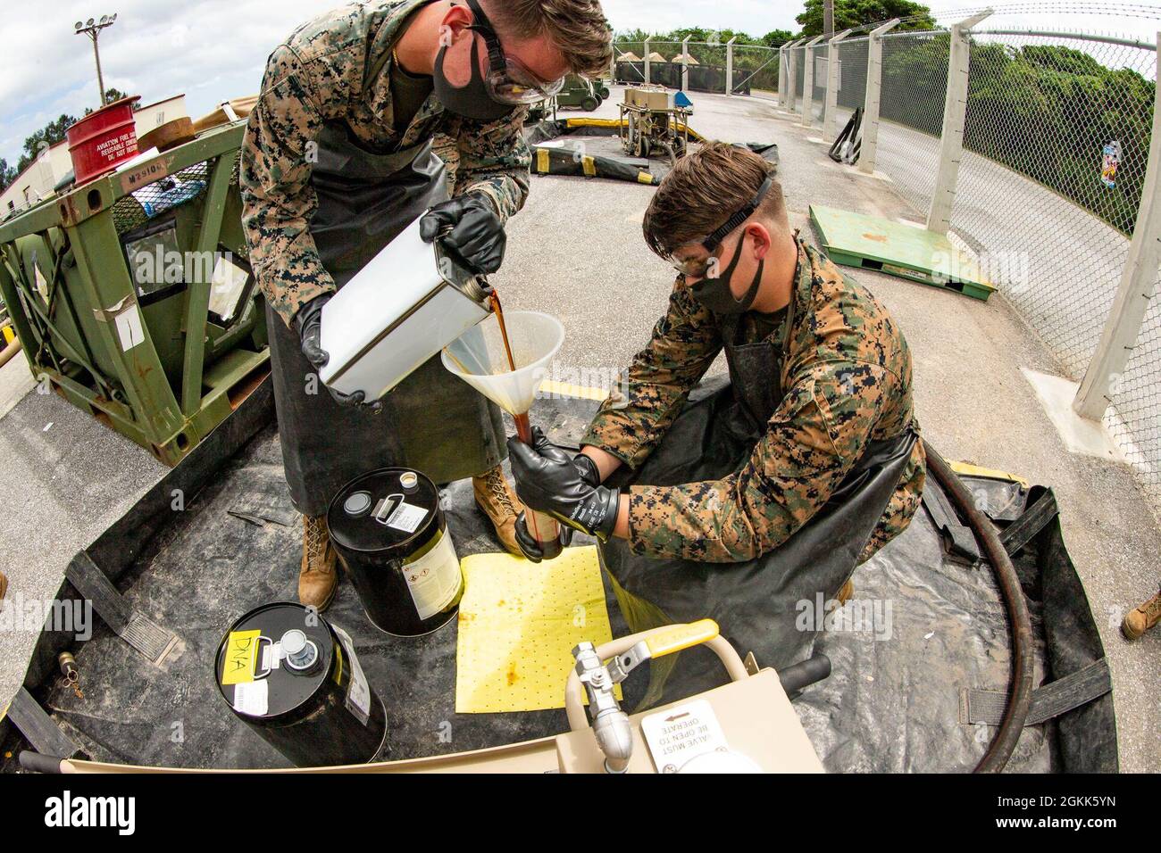 U.S. Marines with 31st Marine Expeditionary Unit (MEU) pour corrosion ...