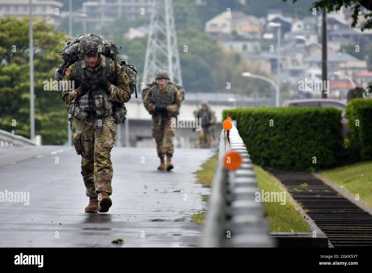 Spc. Kyle Hunsaker, front, assigned to the 247th Military Police ...