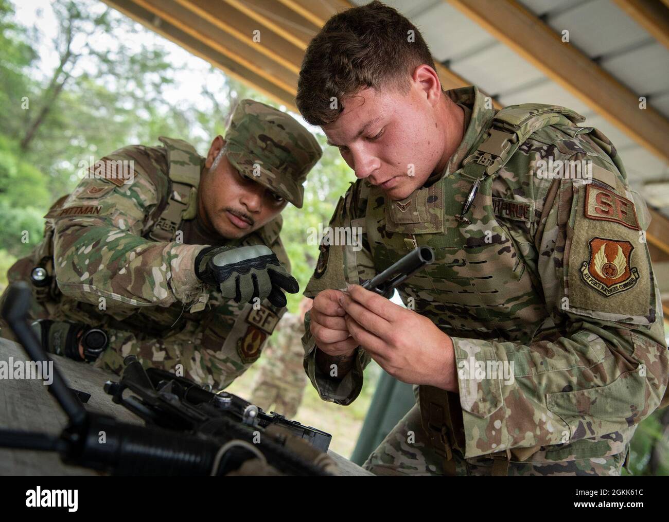 Tech. Sgt. Chalom Pittman helps Airman 1st Class Cody Legan, 96th ...