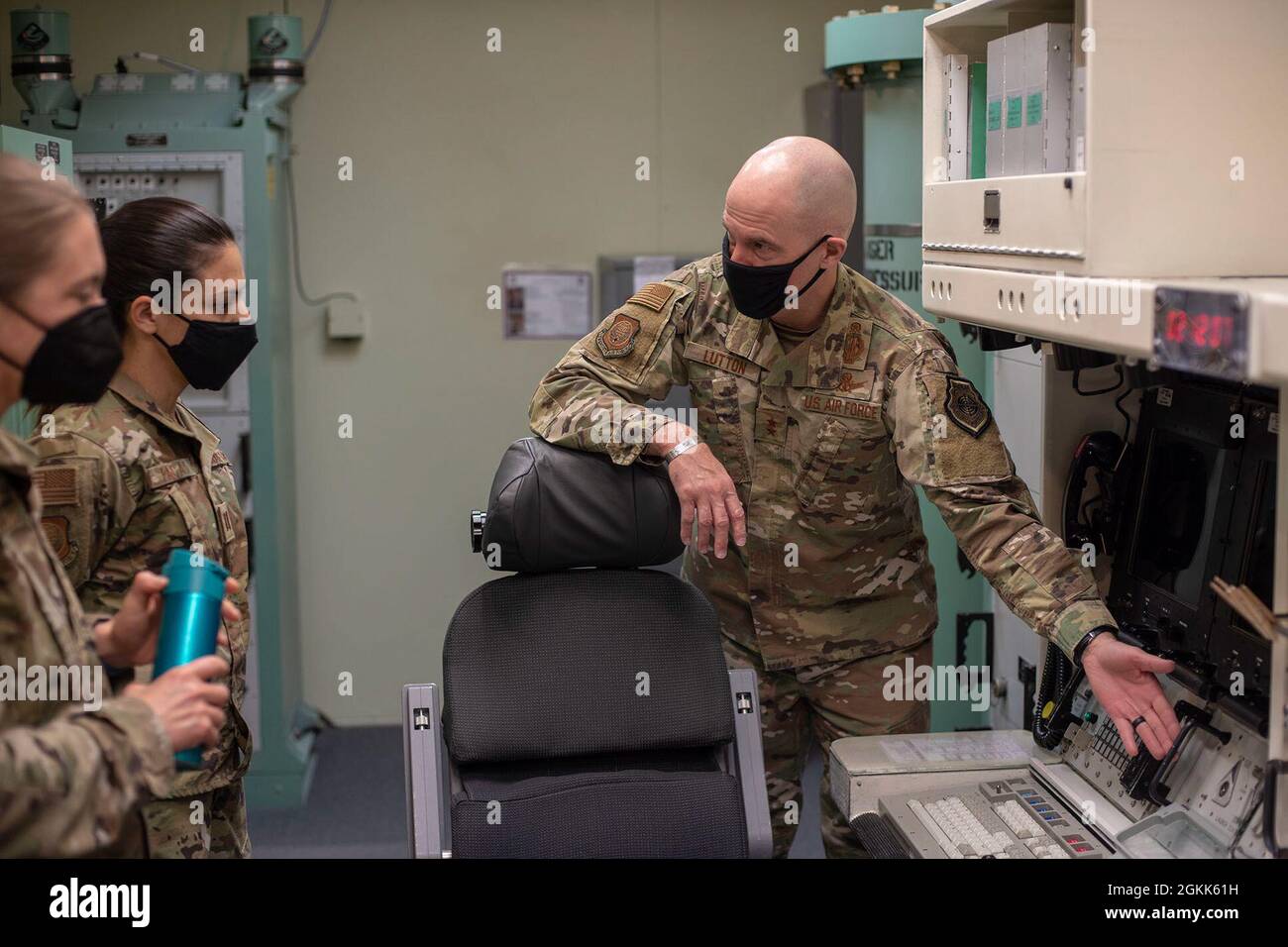 Maj. Gen. Michael J. Lutton, 20th Air Force commander, speaks with Capt ...