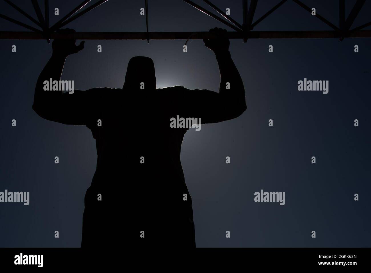 An Airman performs a pull-up during the 355th Security Forces Squadron ...