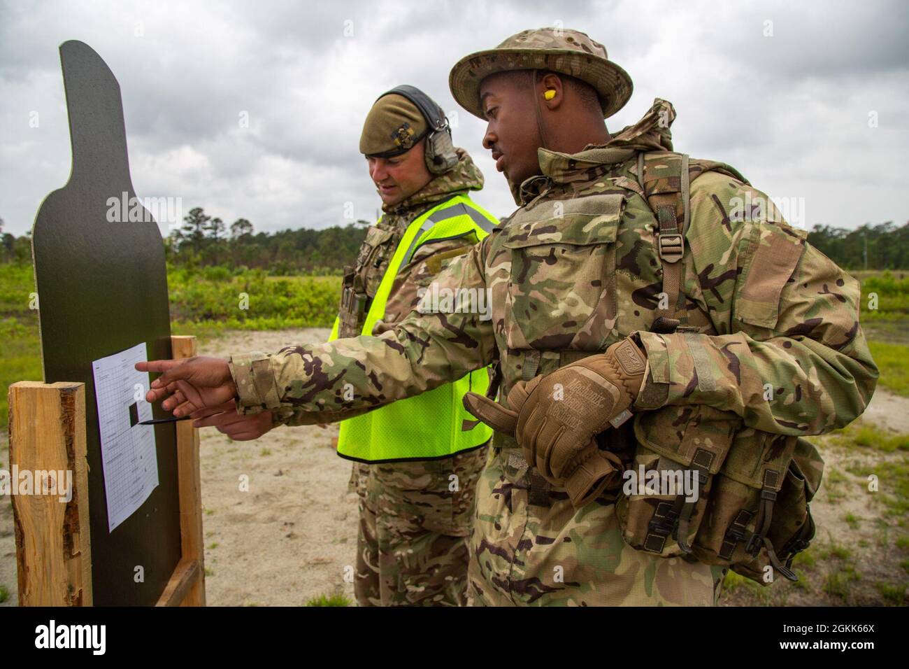 A Royal Bermuda Regiment Soldier views their impacts during a live fire ...
