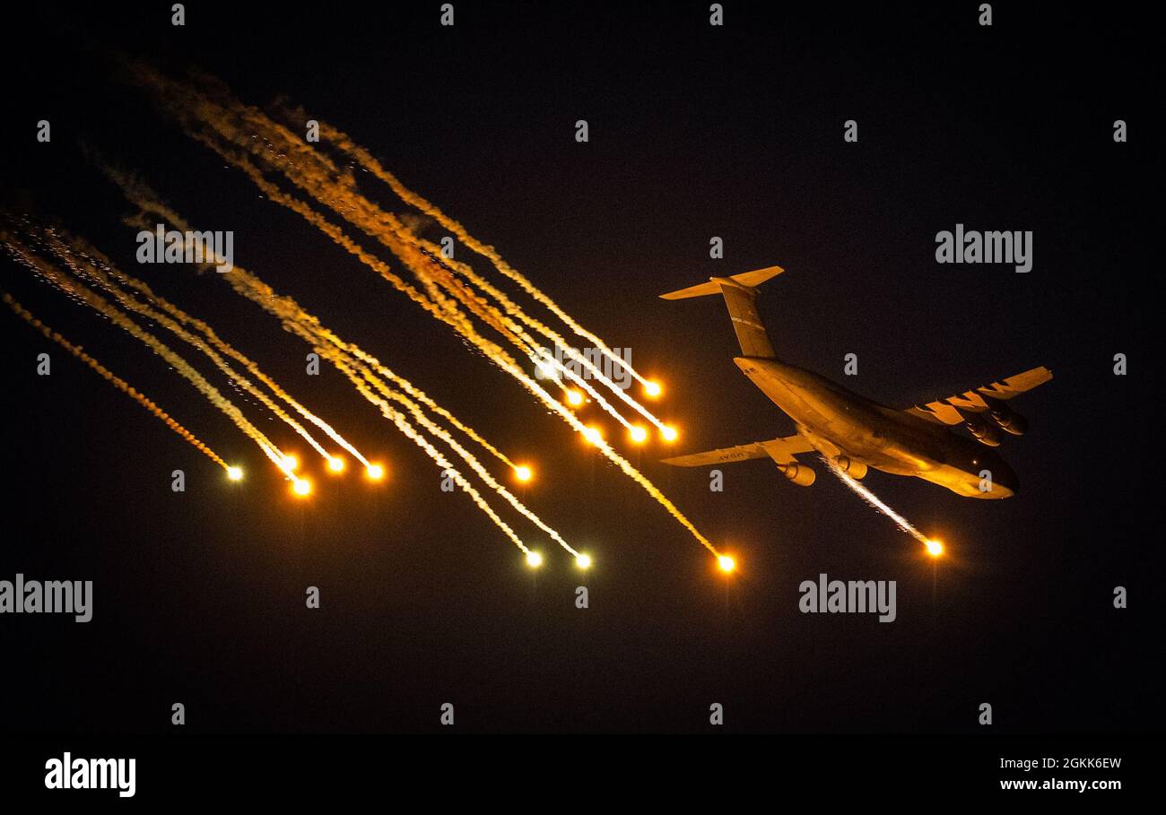 A 436th Airlift Wing C-5M Super Galaxy releases flares during a test ...