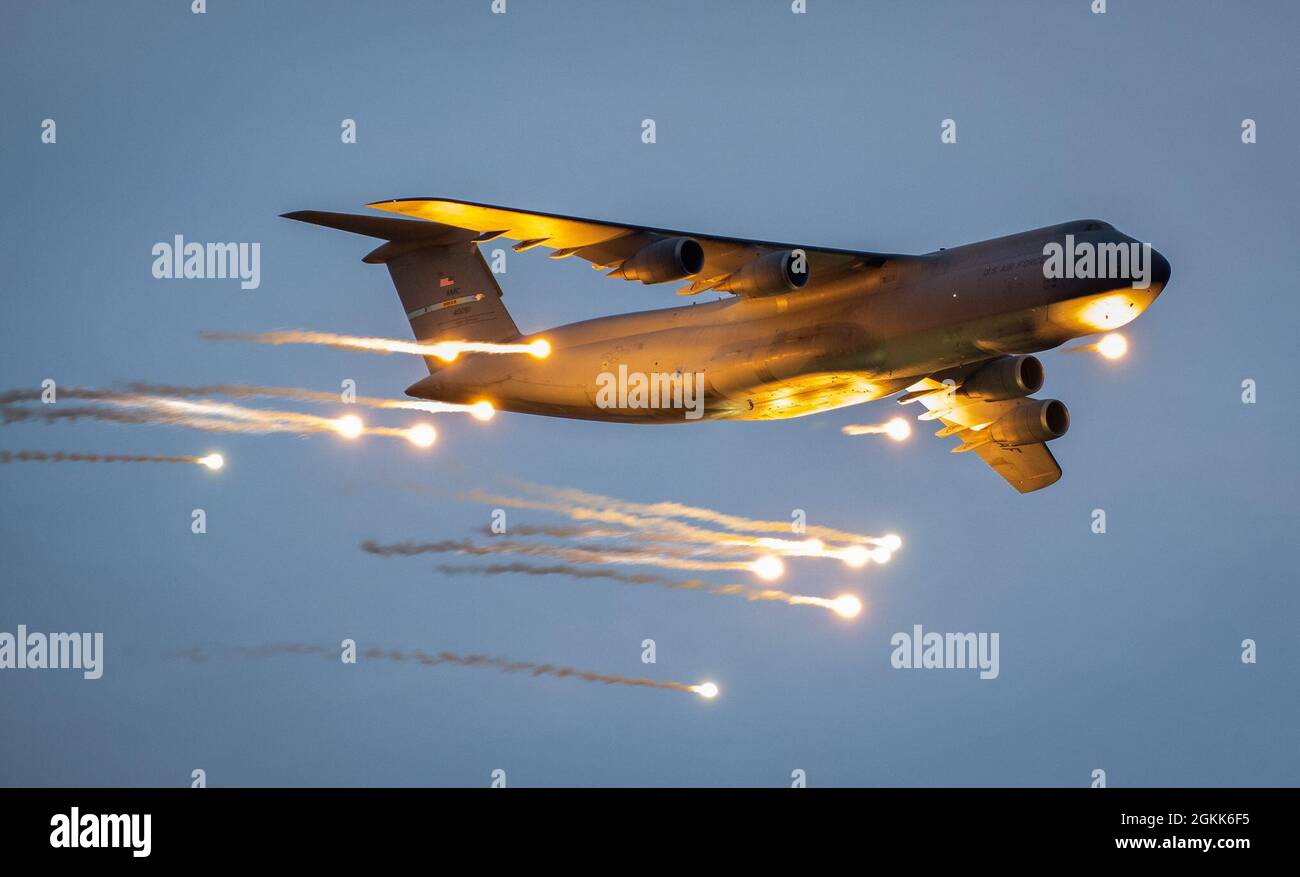 A 436th Airlift Wing C-5M Super Galaxy releases flares during a test ...