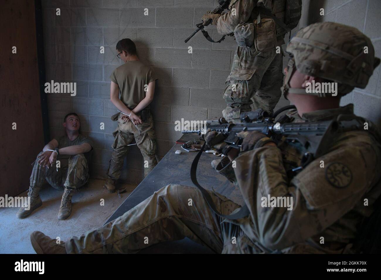 Captured soldiers posing as the OPFOR are watched carefully by squad ...