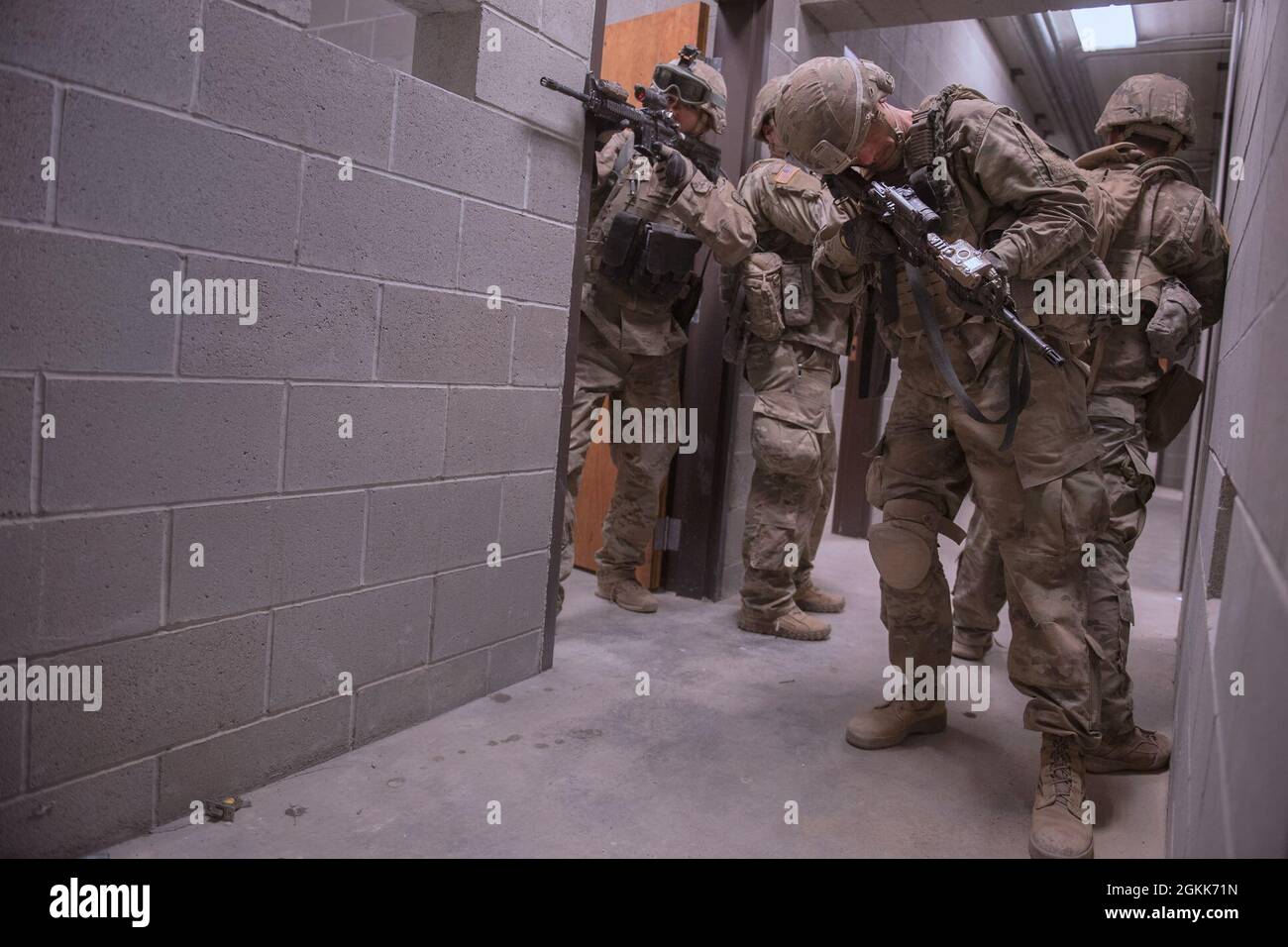 As the squad fills the hallway, soldiers move to their assigned areas ...
