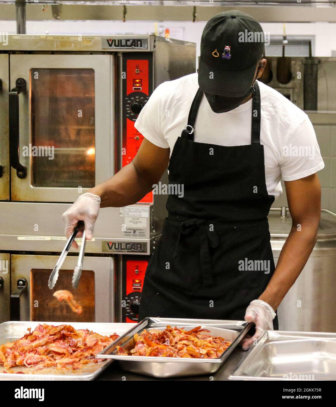Culinary specialists from the 82nd Airborne Division prepare meals as ...
