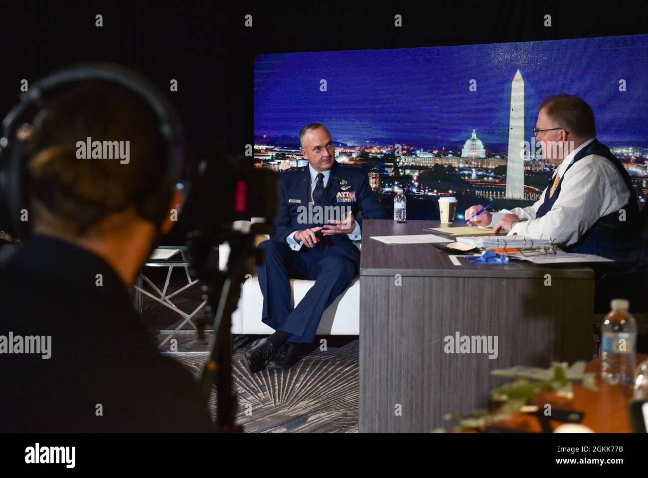 A videographer records as Lt. Gen. Eric Fick, F-35 Joint Program ...
