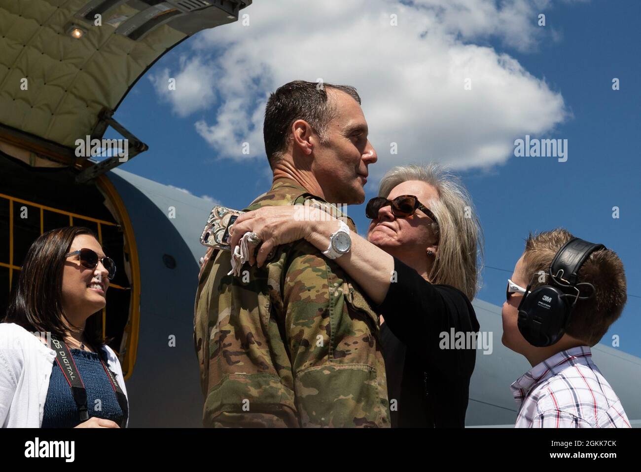 U.S. Air Force Lt. Col. Jason Miller is greeted by his family after ...