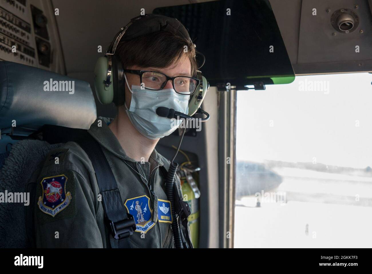 Hunter Willis receives mission instructions from the pilots through his ...