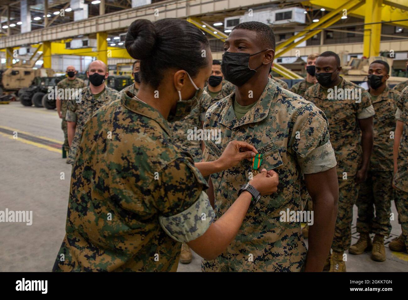 U.S. Marine Cpl. Kenneth L. Robinson, a motor vehicle technician, with ...