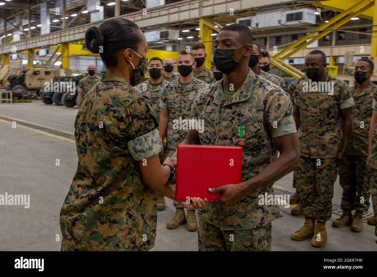 U.S. Marine Cpl. Kenneth L. Robinson, a motor vehicle technician, with ...