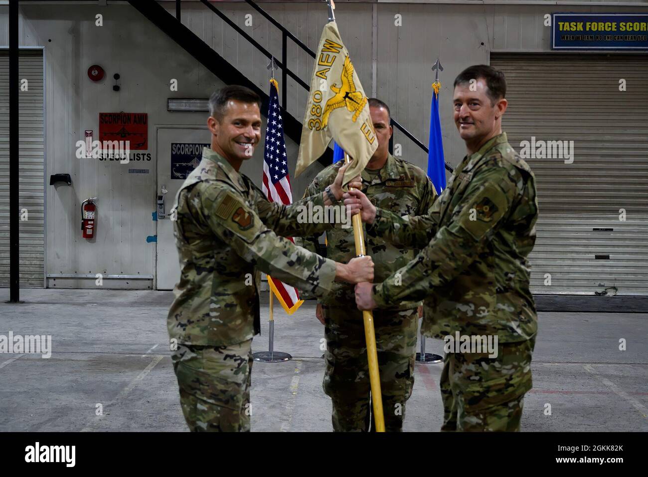 U.S. Air Force Brig. Gen. Larry Broadwell presents the guidon to Col ...
