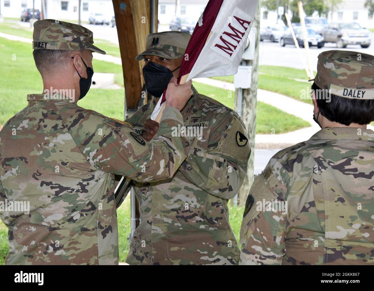 Capt. Chris Wright, center, accepts the colors from Col. John “Ryan ...