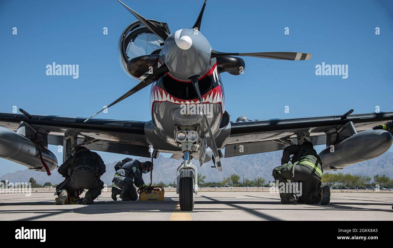Maintenance troops from the Republic of Colombia perform pre-flight ...
