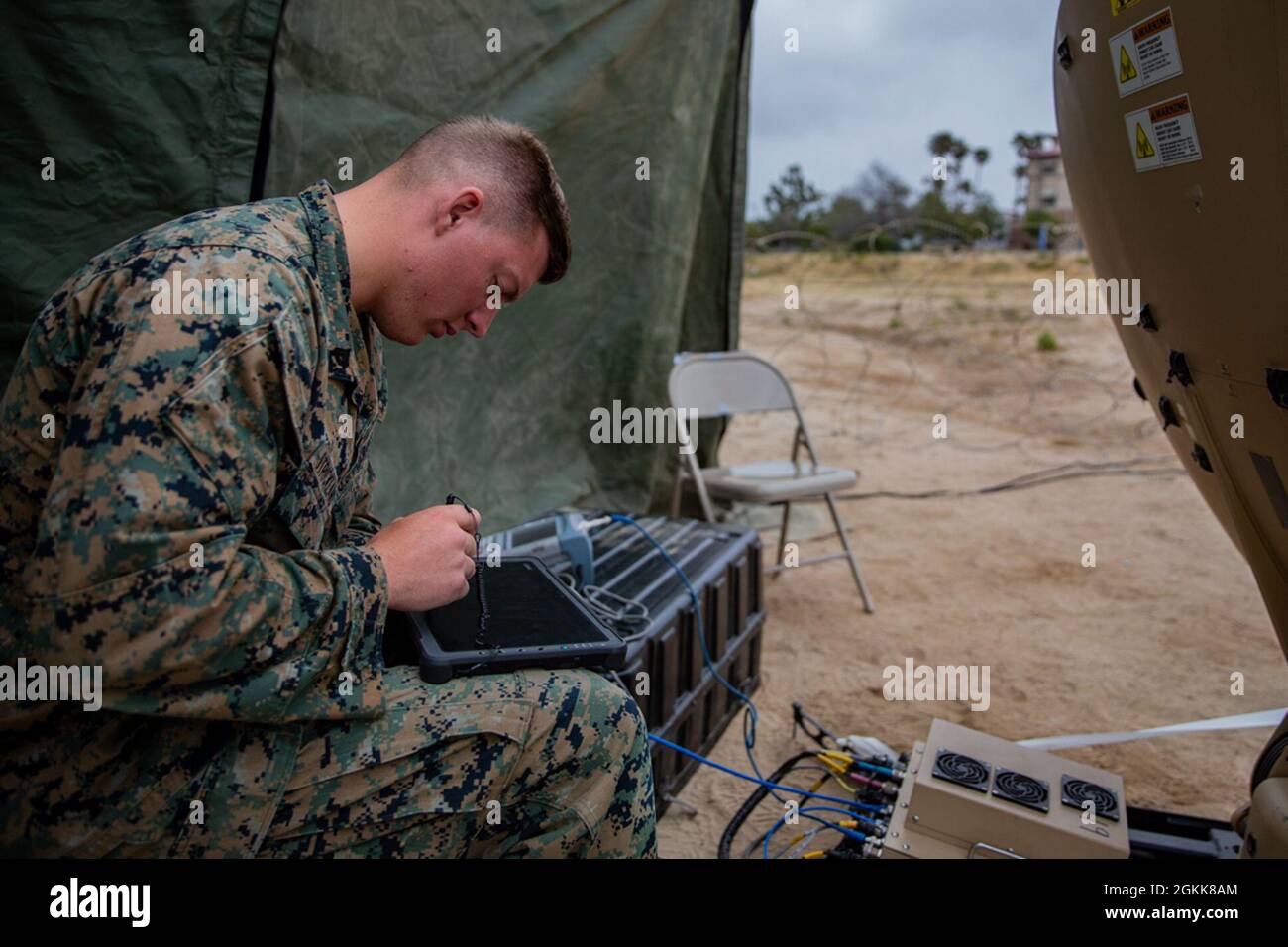 U.S. Marine Corps Cpl. Samuel Strickland, a satellite communications ...