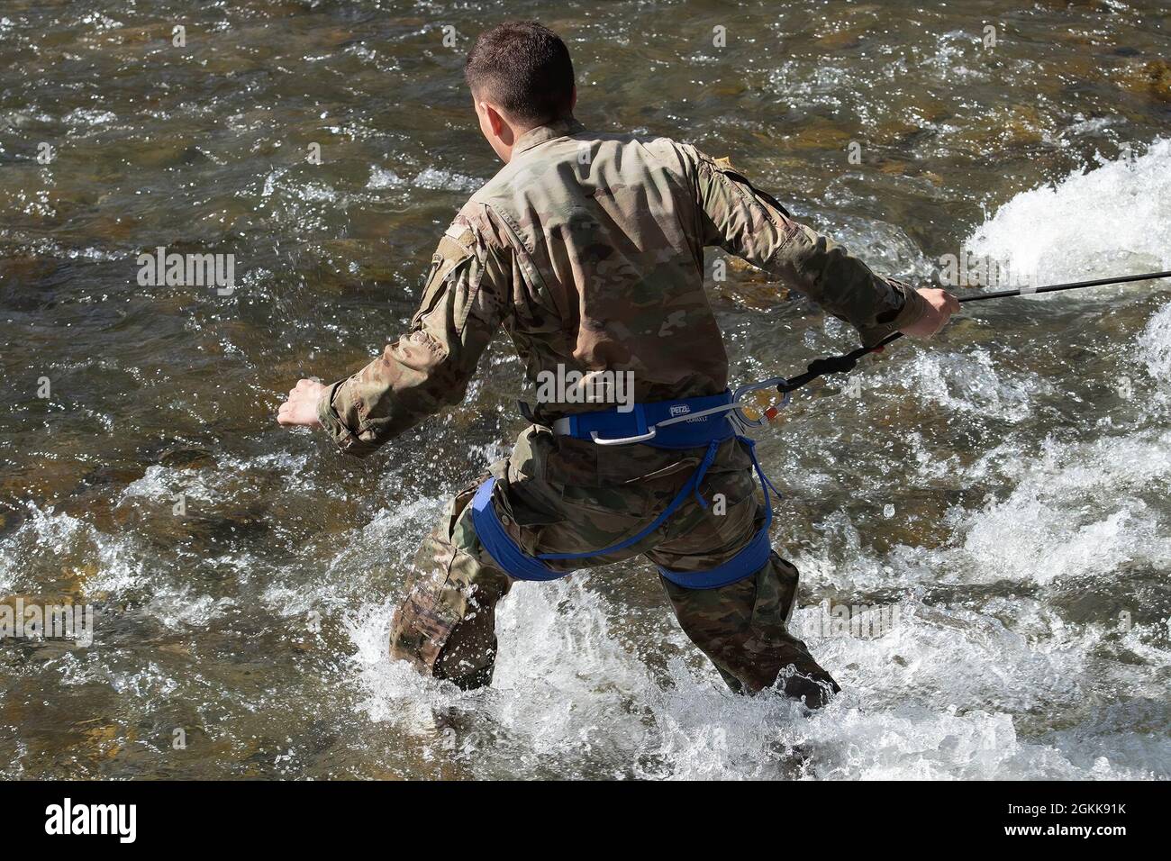 Cpl. Jacob Ryan Jenkins makes his way carefully across a water obstacle ...