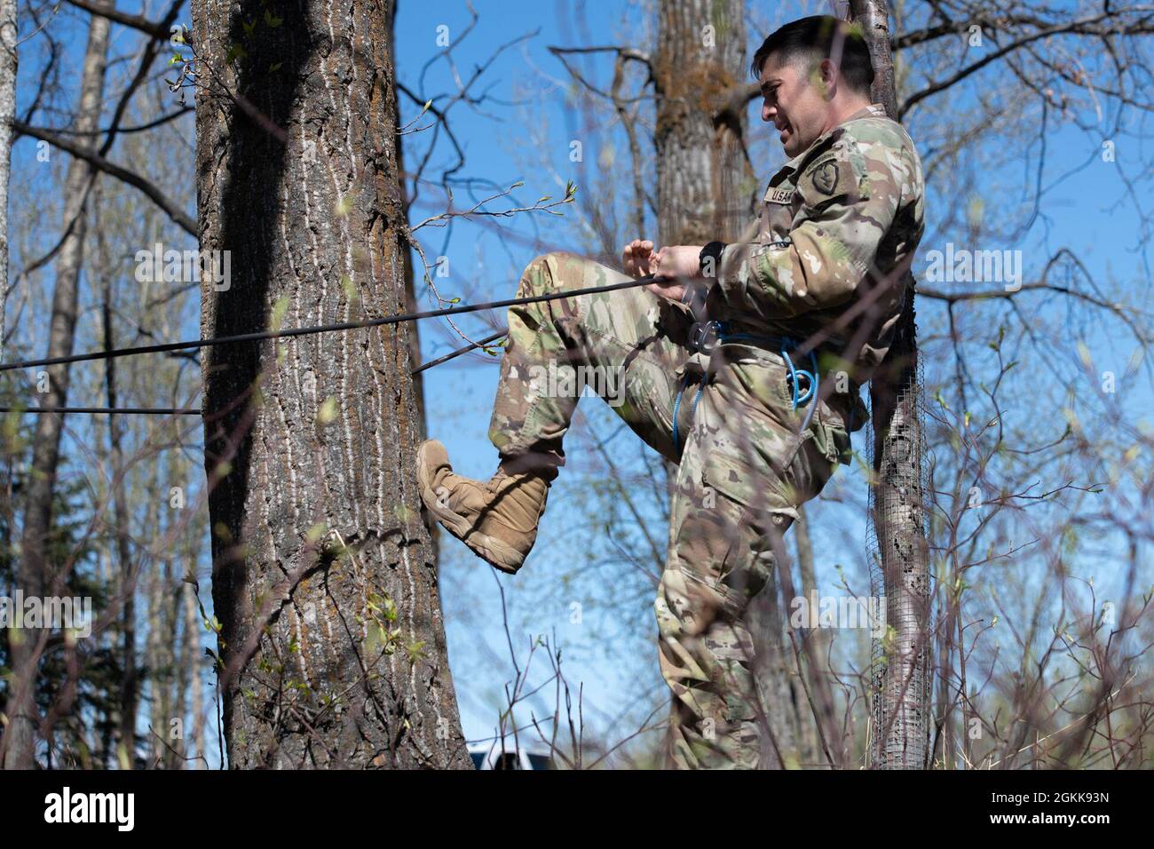 Sgt. 1st Class Randall Henrion loosens a knot to enable his platoon to ...