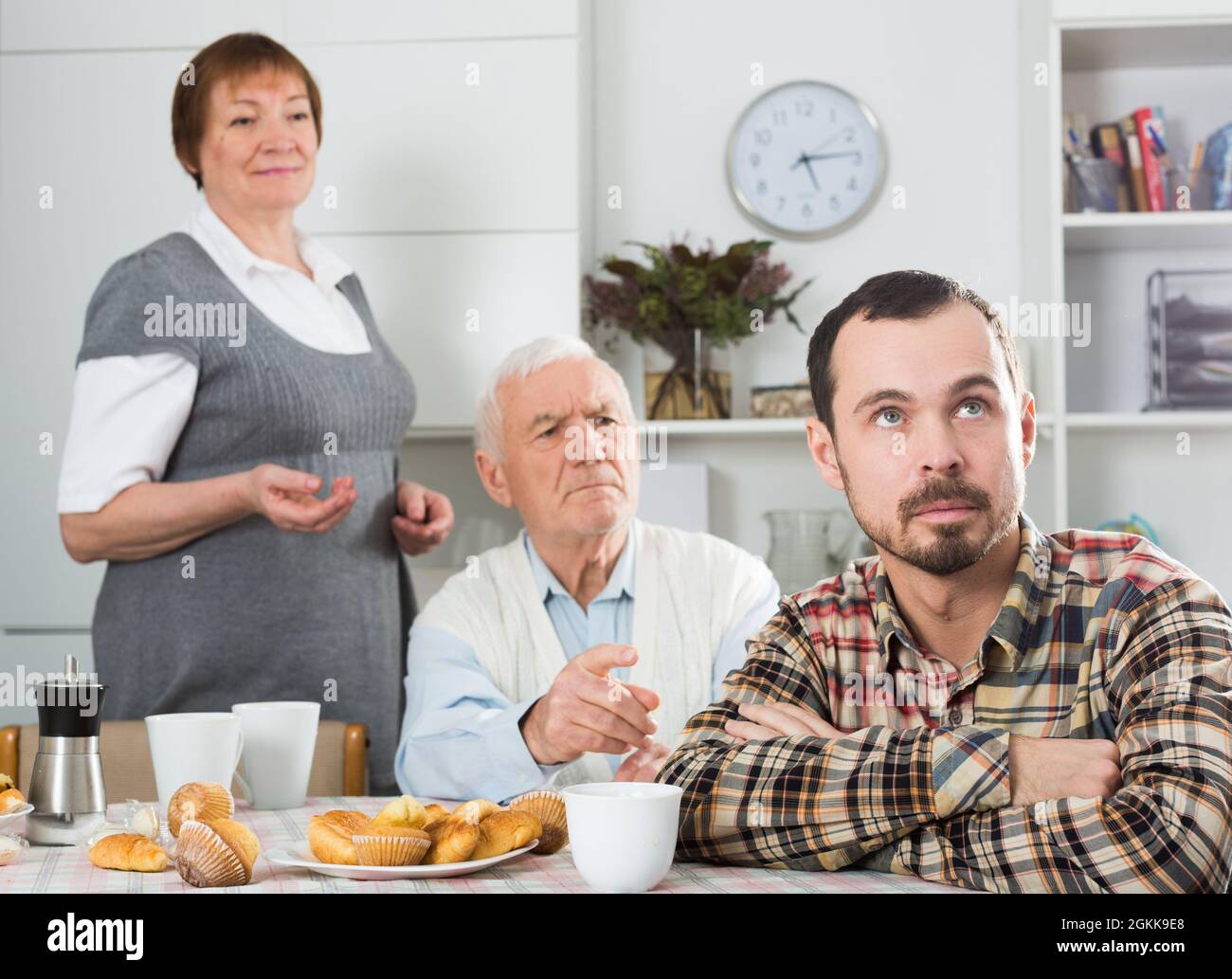 Parents arguing with son Stock Photo - Alamy