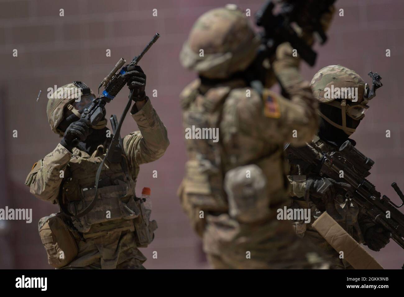 Charlie Company soldiers exchange fire with OPFOR soldiers firing from ...