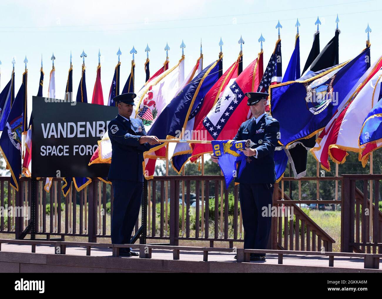 Col. Kris Barcomb, 30th Operations Group commander, furls the ...