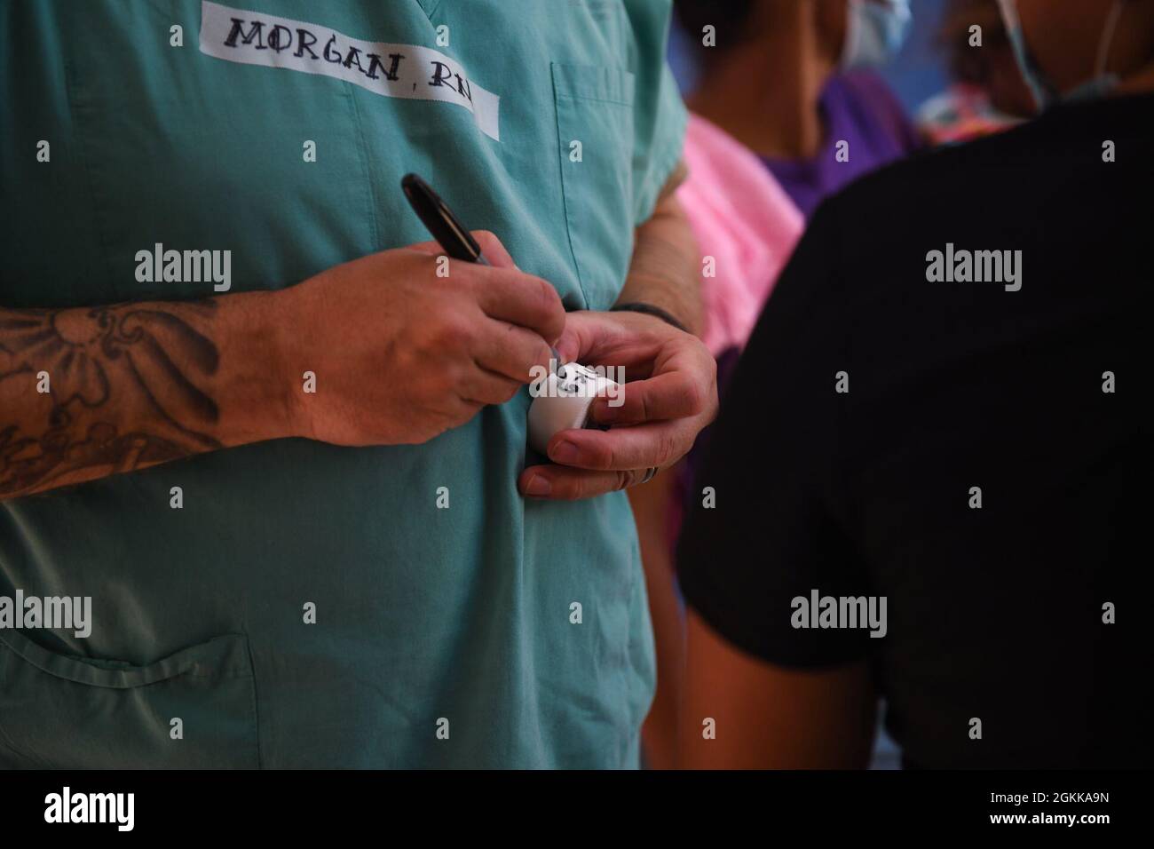 U.S. Army Maj. Morgan Torris-Hedlund, a public health nurse with the ...