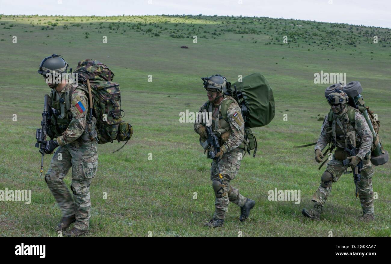 Netherlands soldiers assigned to 11th Airborne Battalion maneuver to a ...