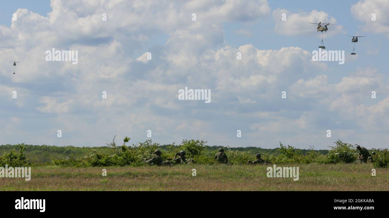 Soldiers with Task Force Falcons look overhead as CH-47 Chinook ...