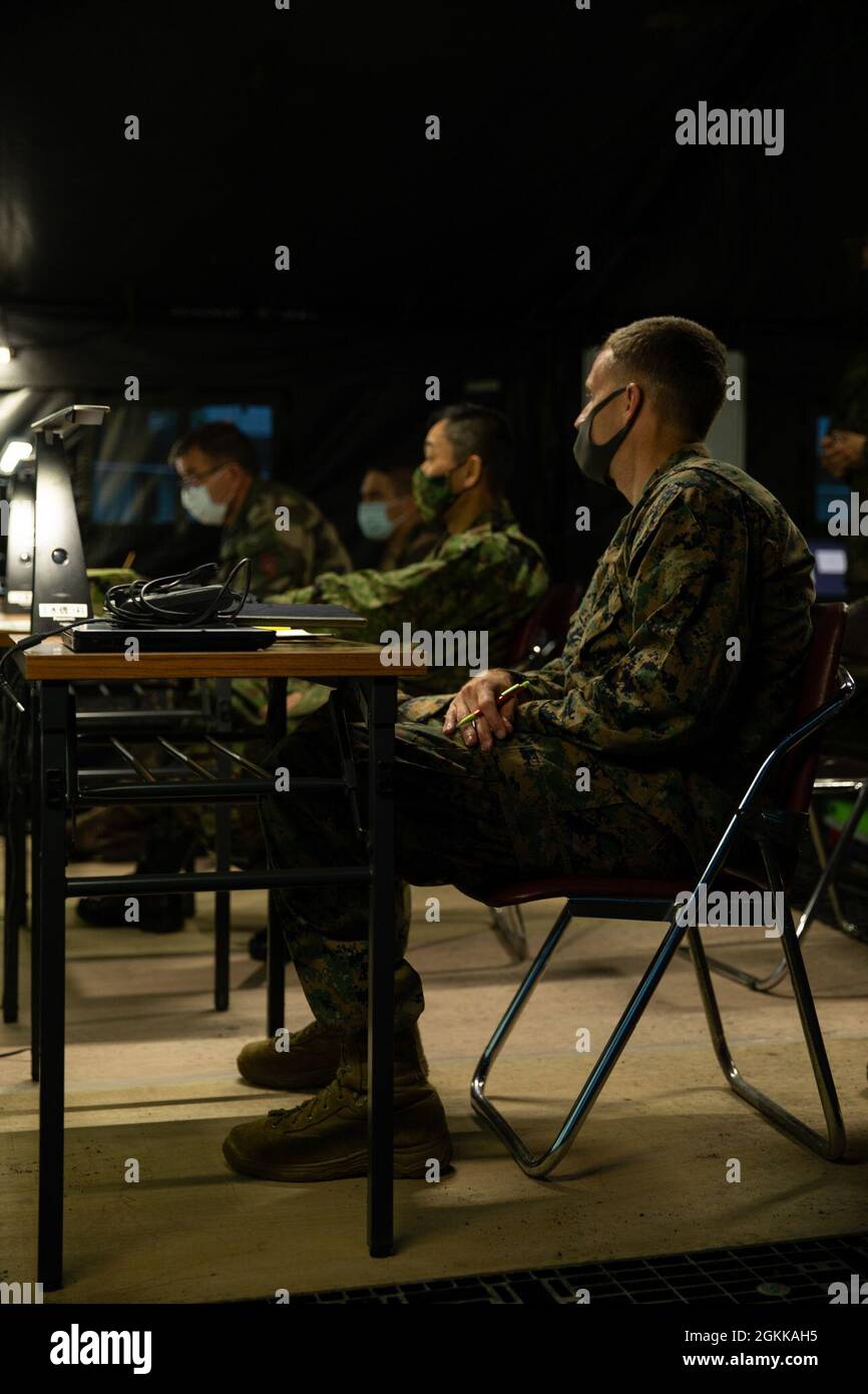 Lt. Col. Jeremy Nelson, commander of Marine Forces (right), Col ...