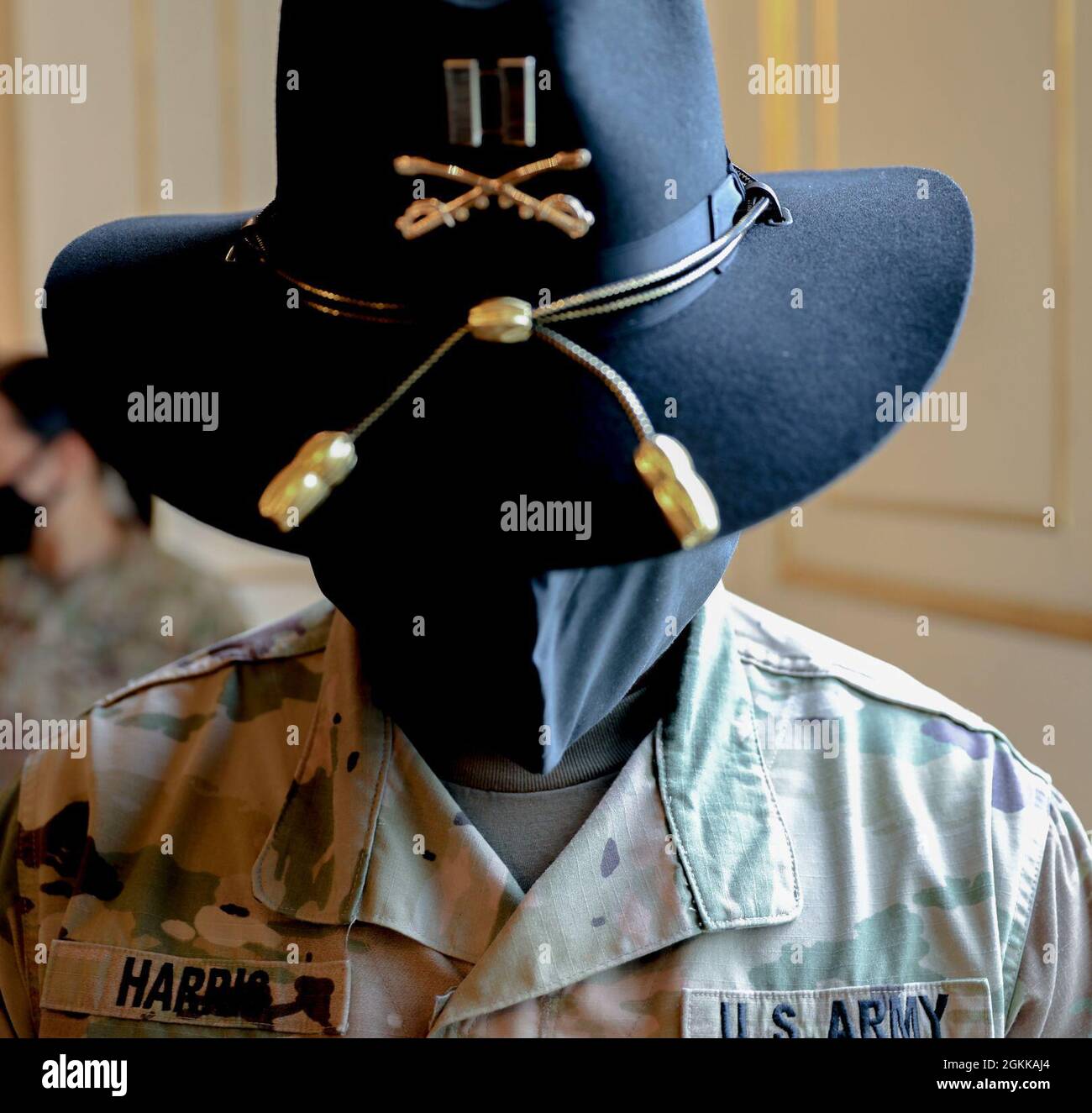 Capt. Cameron Harris, 1st Armored Brigade Combat Team, lowers his head ...