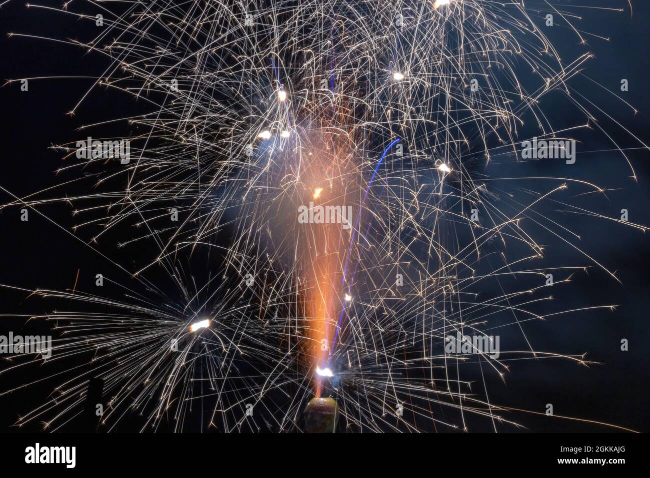 horizontal of a ground firework shooting sparks up into the air Stock ...