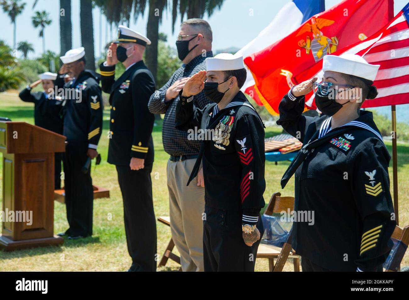 210514-N-LW757-1050 SAN DIEGO (May 14, 2021) Attendees salute the ...